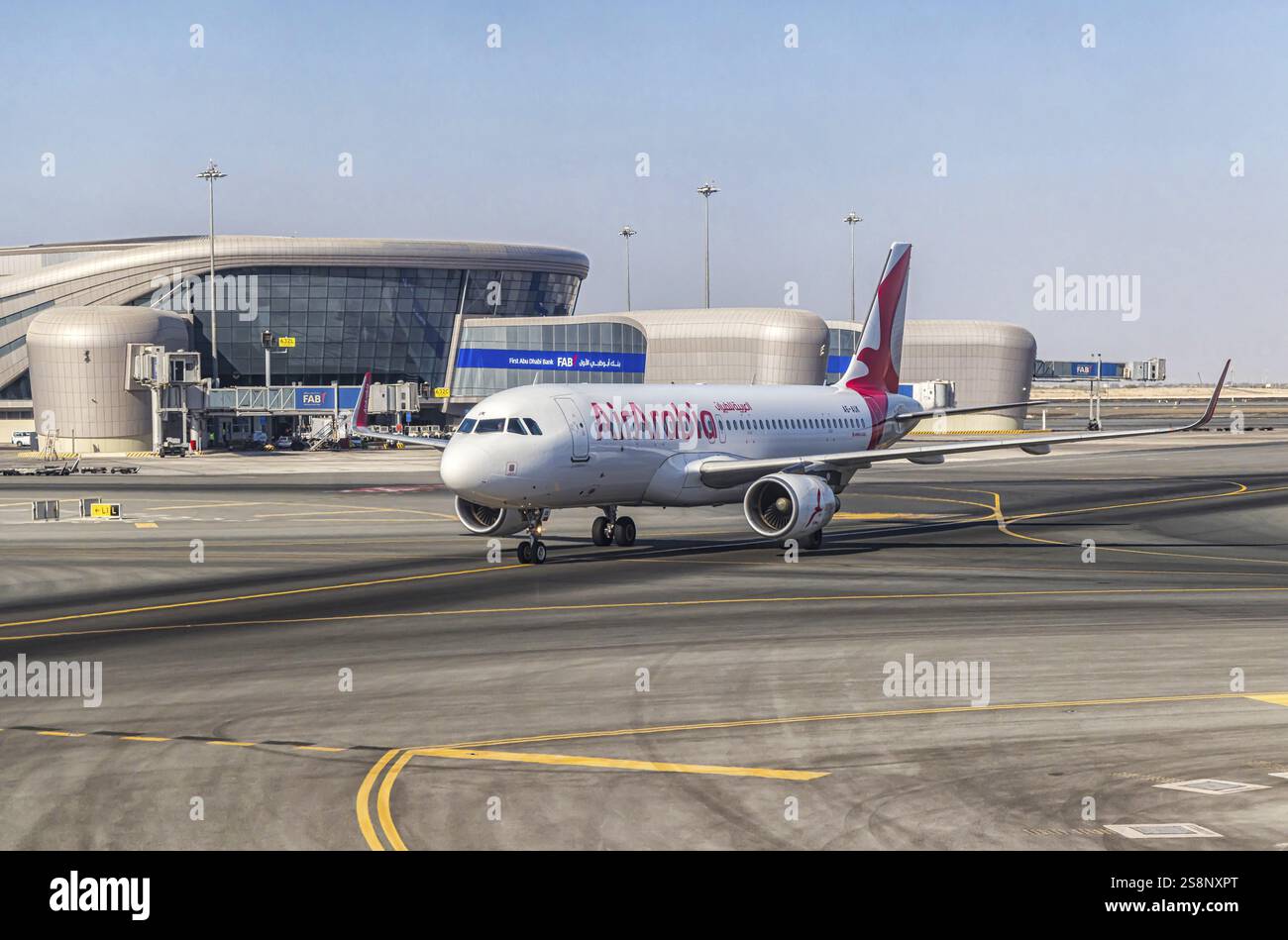 Air Arabia aircraft at Abu Dhabi Airport, Zayed International Airport with Terminal A. It has a ...