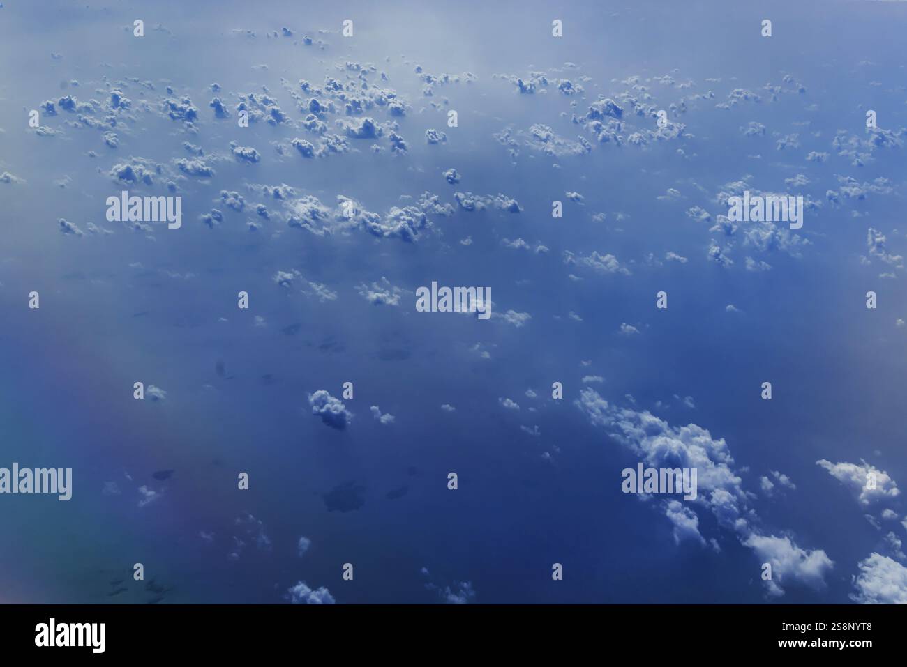 Blue sky, cloud structures over the Arabian Sea. View from the aircraft ...