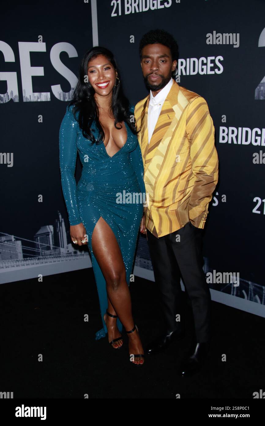 Taylor Simone Ledward and Chadwick Boseman arriving at a screening of "21 Bridges" at the AMC ...