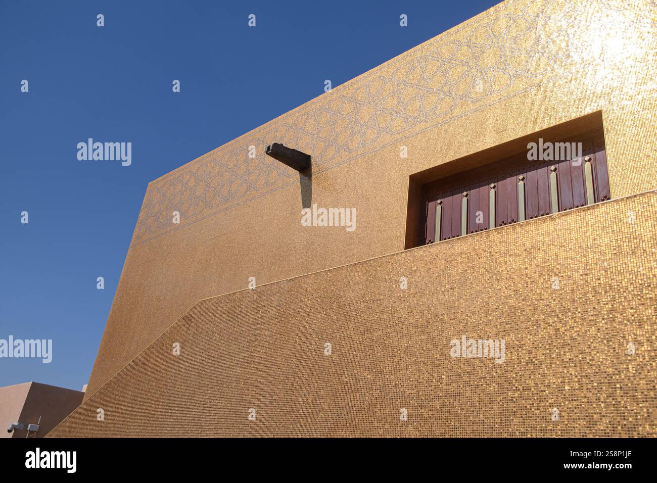 Doha, Qatar - January 4, 2025: A detailed view of the golden facade of ...