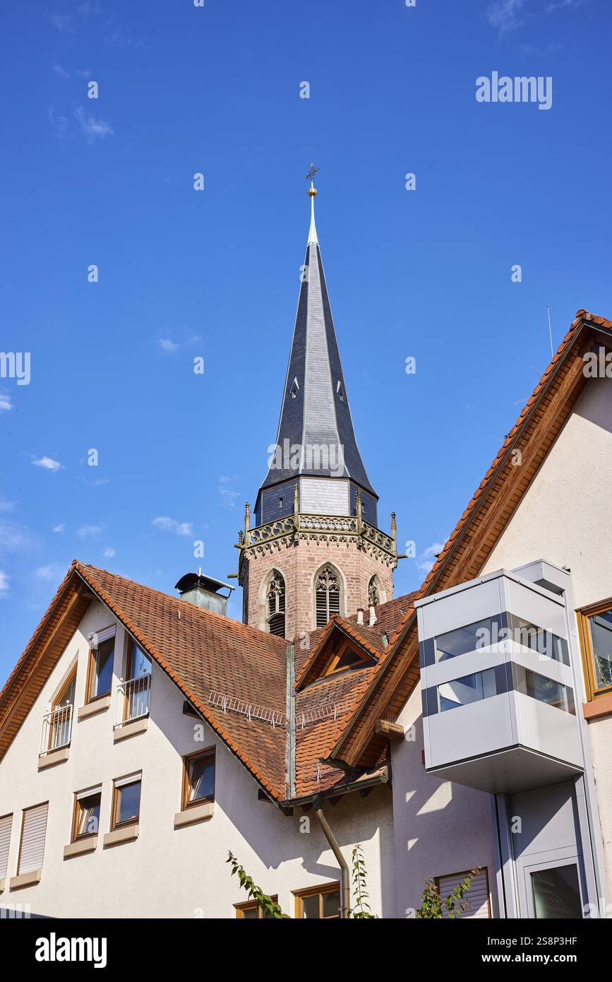 Church tower of St. Nikolaus, residential building, pointed roof with ...