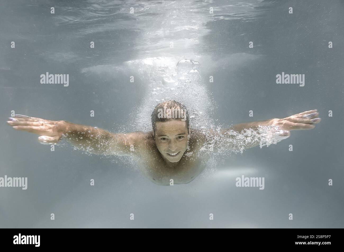 Man dives in pool hi-res stock photography and images - Alamy
