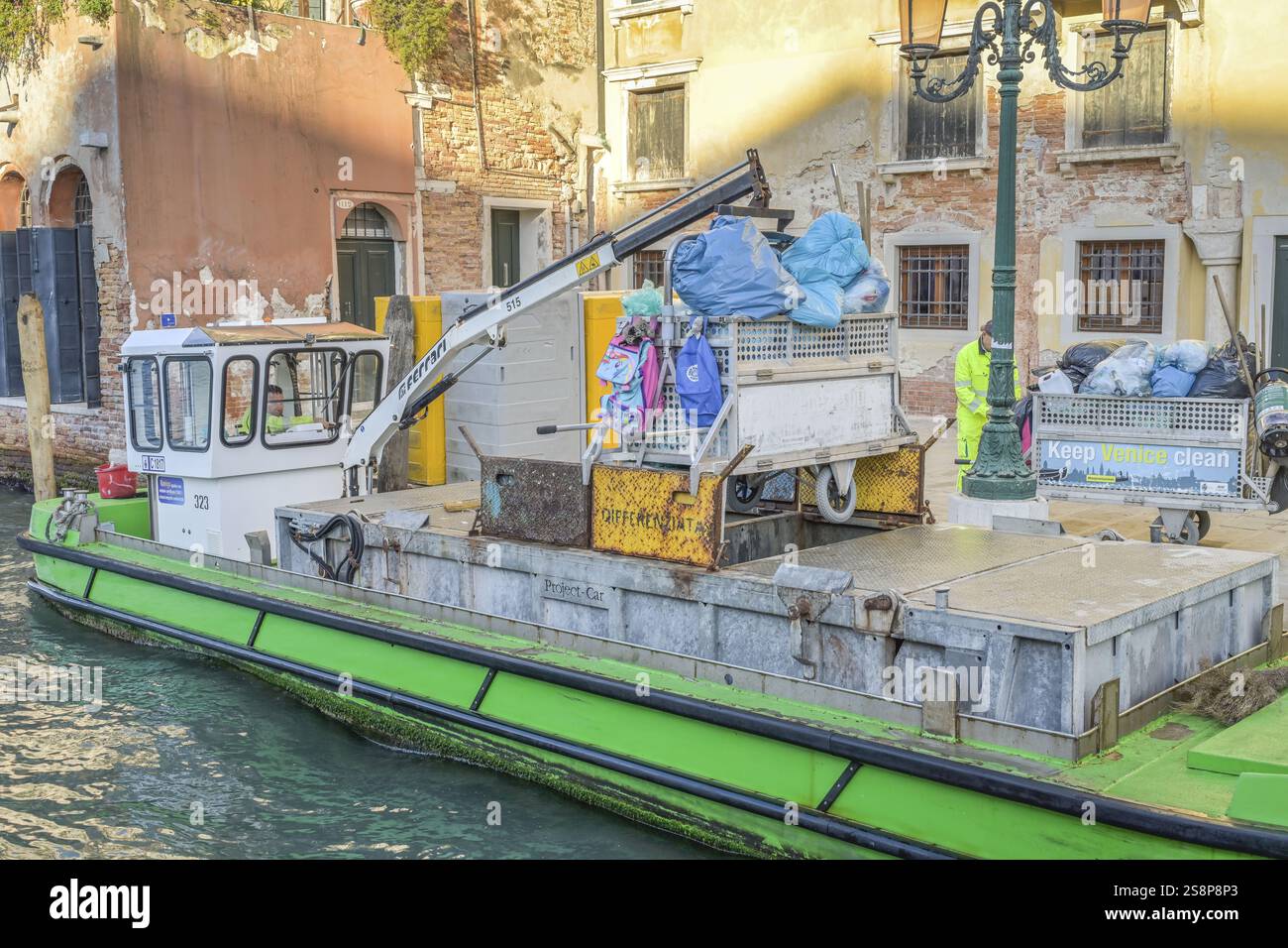 Rubbish collection with a city cleaning boat, Grand Canal, Venice ...