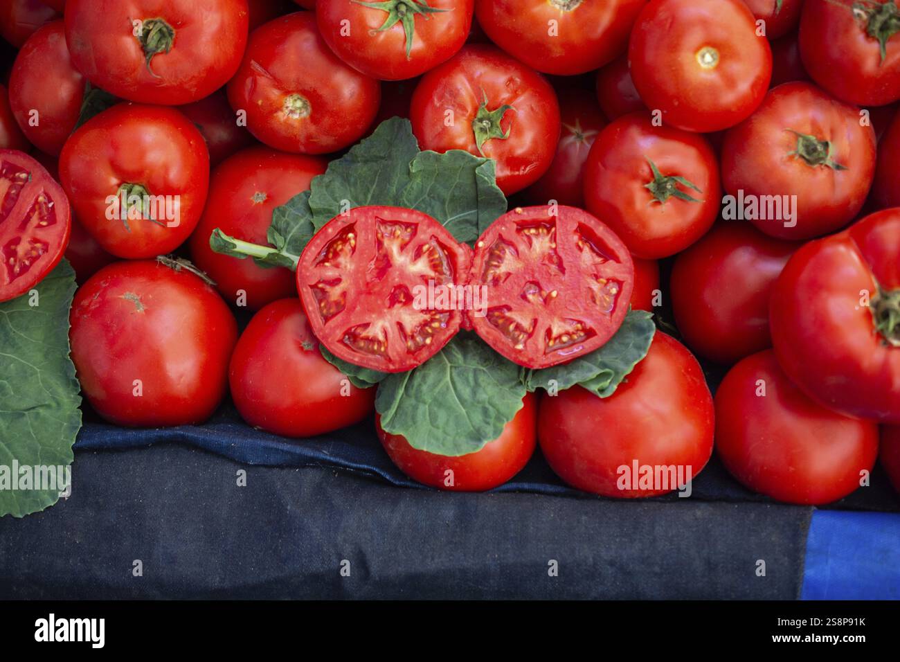 Fresh cut tomato at grocery store for food backgrounds concept Stock ...