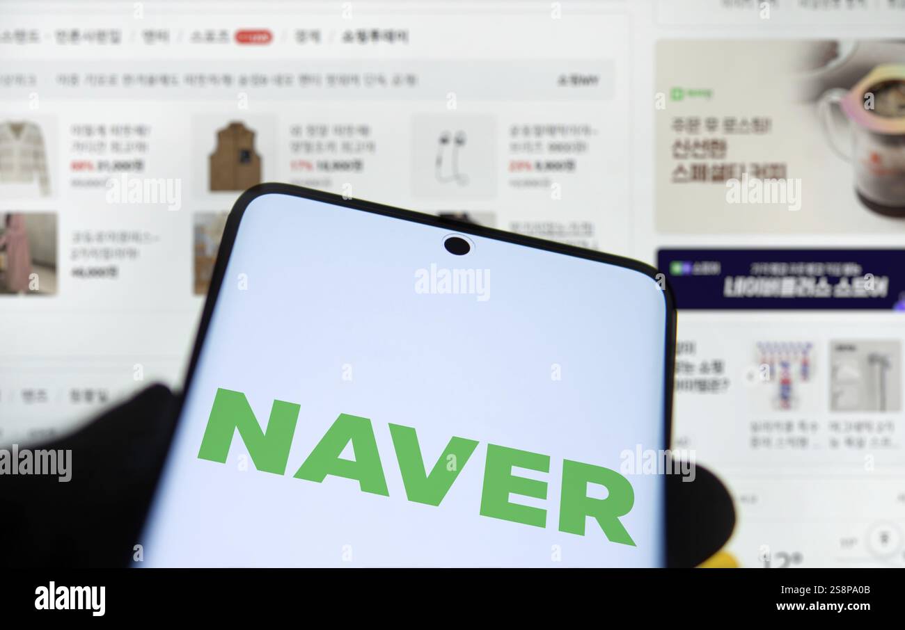 Naver logo is displayed on smartphone. Naver Corporation is a South ...