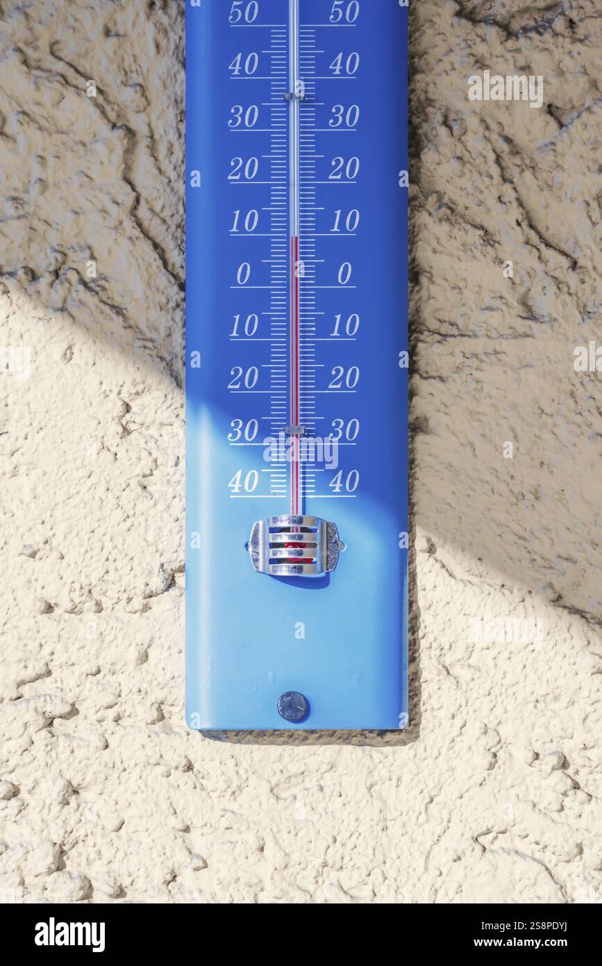 An image of a typical thermometer outside on a house wall Stock Photo ...