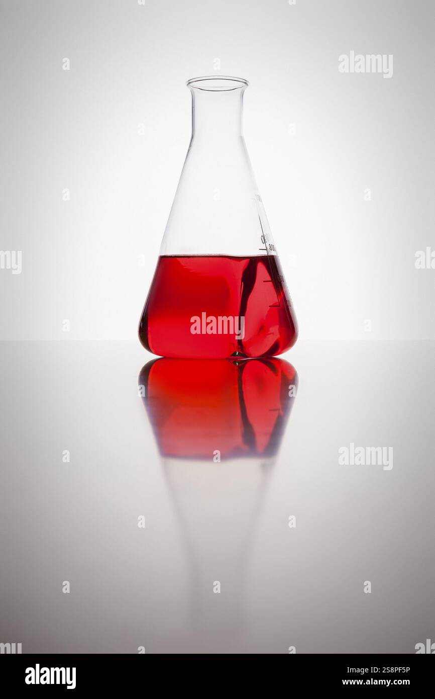 A glass bottle with red liquid in a laboratory Stock Photo - Alamy