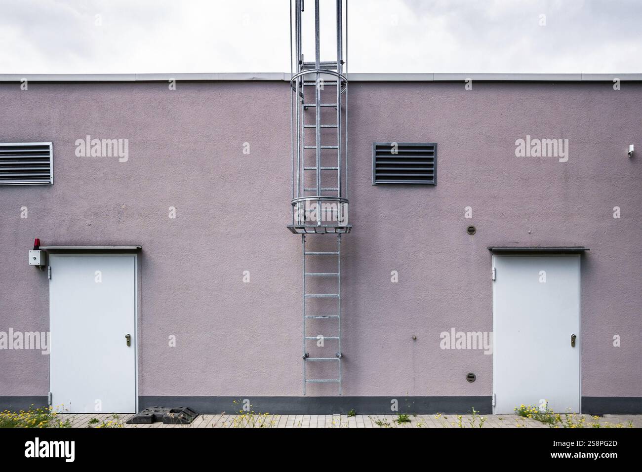 An image of a wall with doors and ladder Stock Photo - Alamy