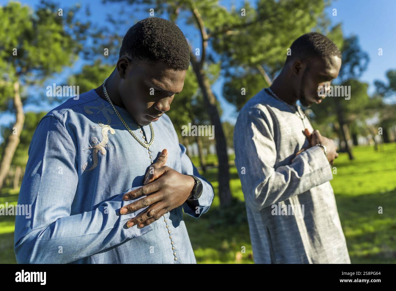 Two young senegalese men wearing traditional dashiki clothing are ...