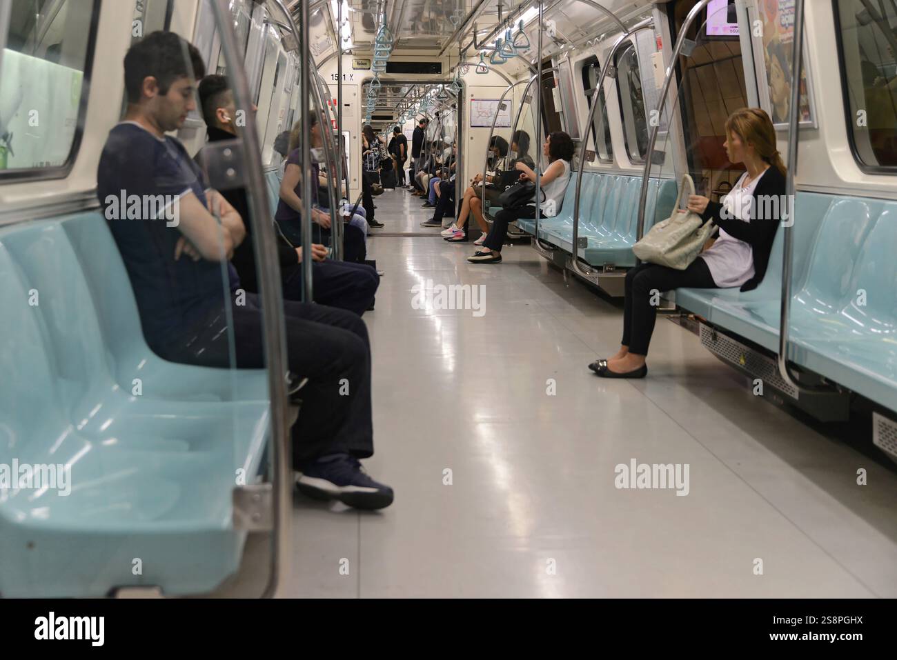 Passengers in a metro carriage, sitting and standing, Istanbul ...