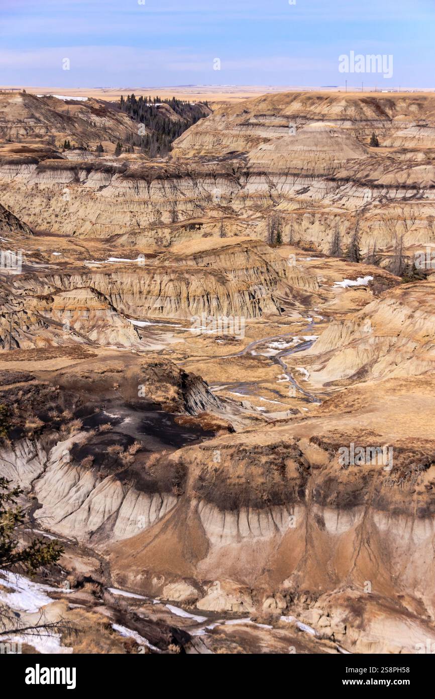 A desolate landscape with a river running through it. The river is ...