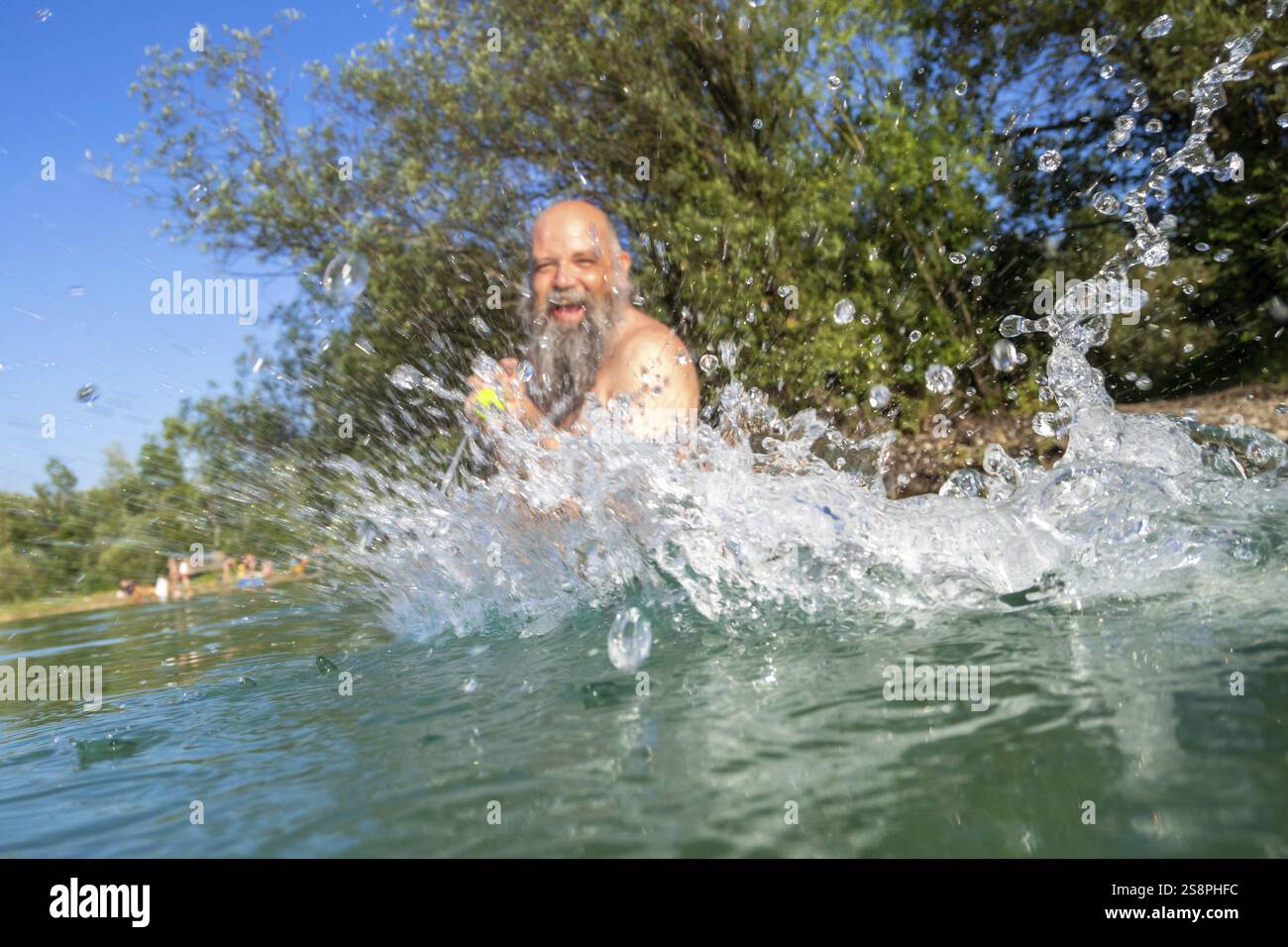 An image of a water battle at the summer lake Stock Photo - Alamy