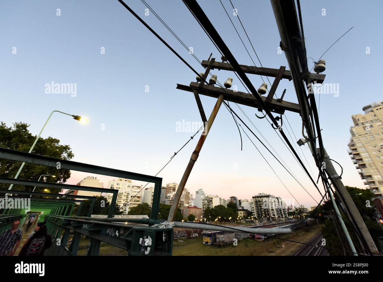 Old electric towers next to the train tracks in the city of Buenos ...