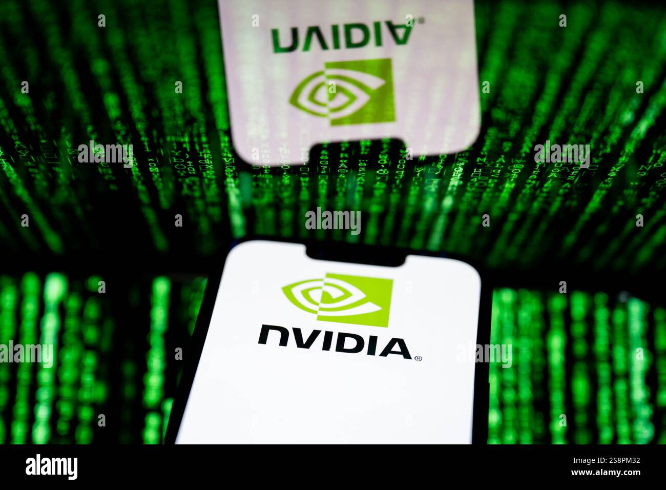 In this photo illustration, the Nvidia logo seen displayed on a ...