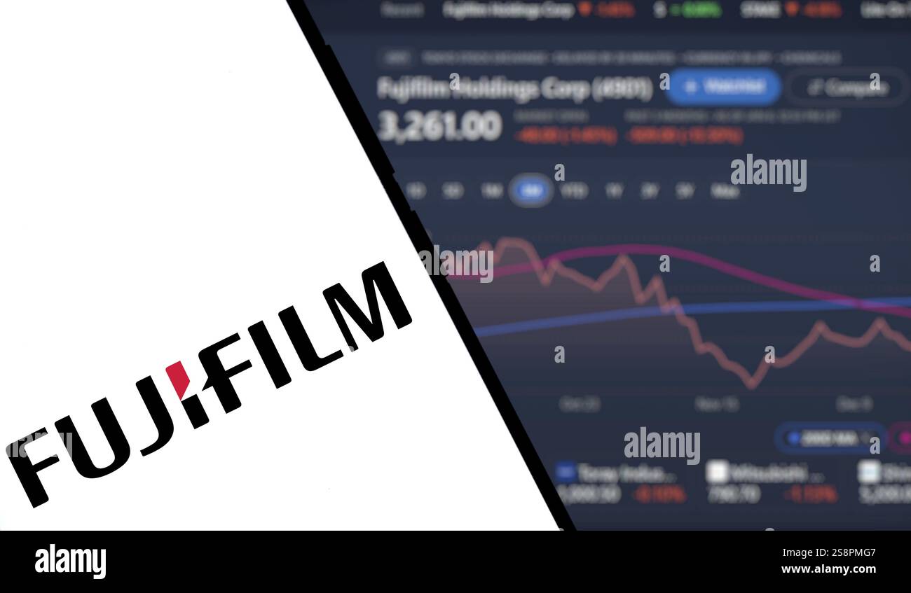 Fujifilm logo is displayed on smartphone. Fujifilm Holdings Corporation ...