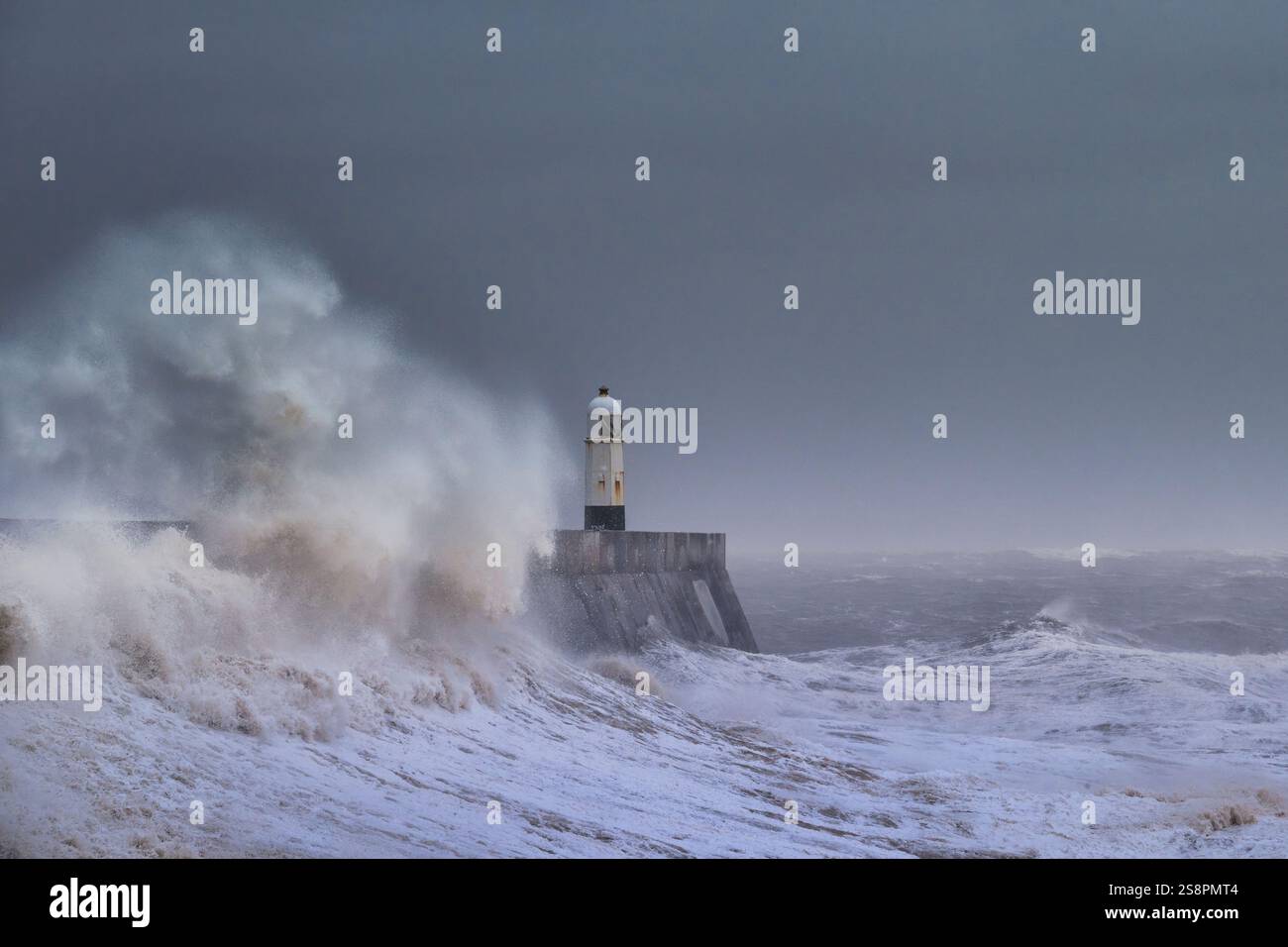 A huge winter storm hitting the coast of the UK. Giant waves crash into ...