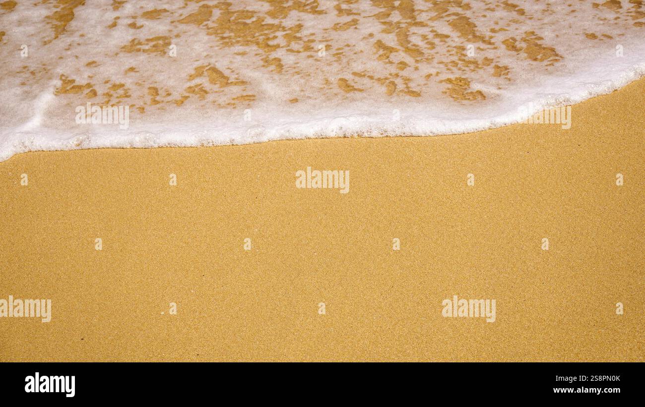 An image of a sandy beach shore line texture background Stock Photo - Alamy