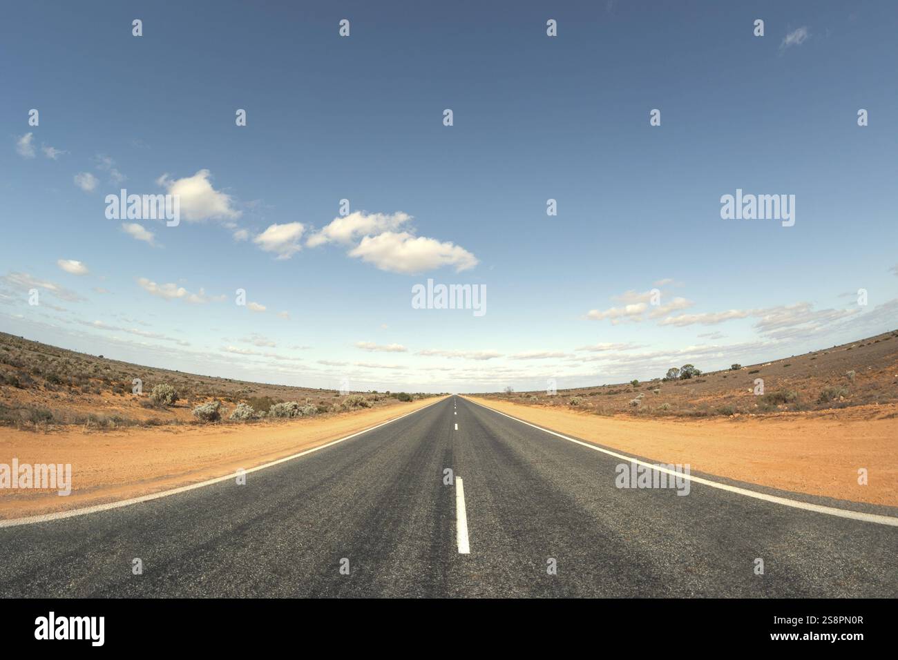 An image of a road in Australia with curved horizon Stock Photo - Alamy