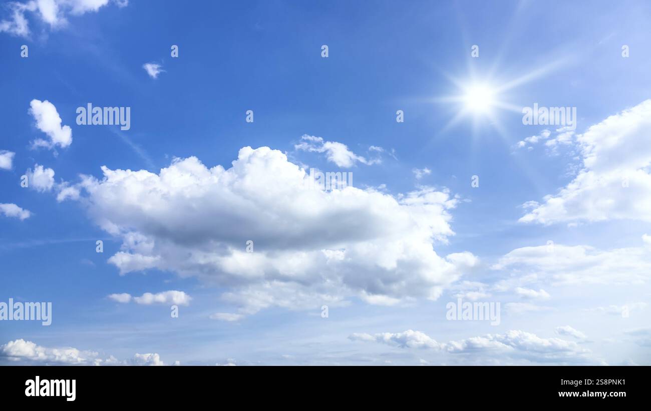 An image of a typical beautiful blue sky sun clouds background Stock Photo - Alamy
