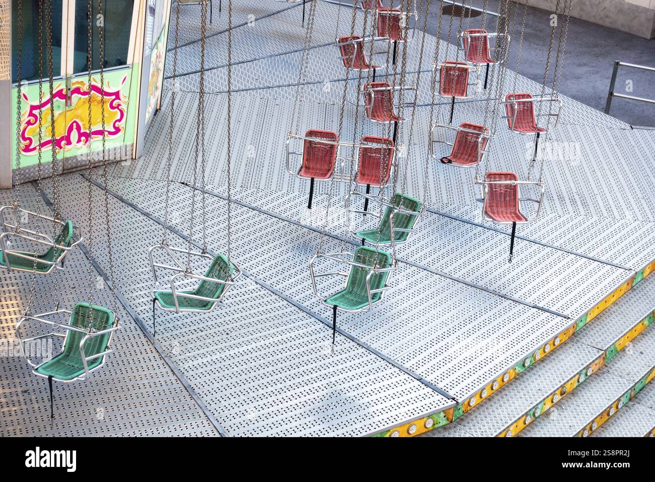 An image of a typical carousel with red and green chairs Stock Photo ...
