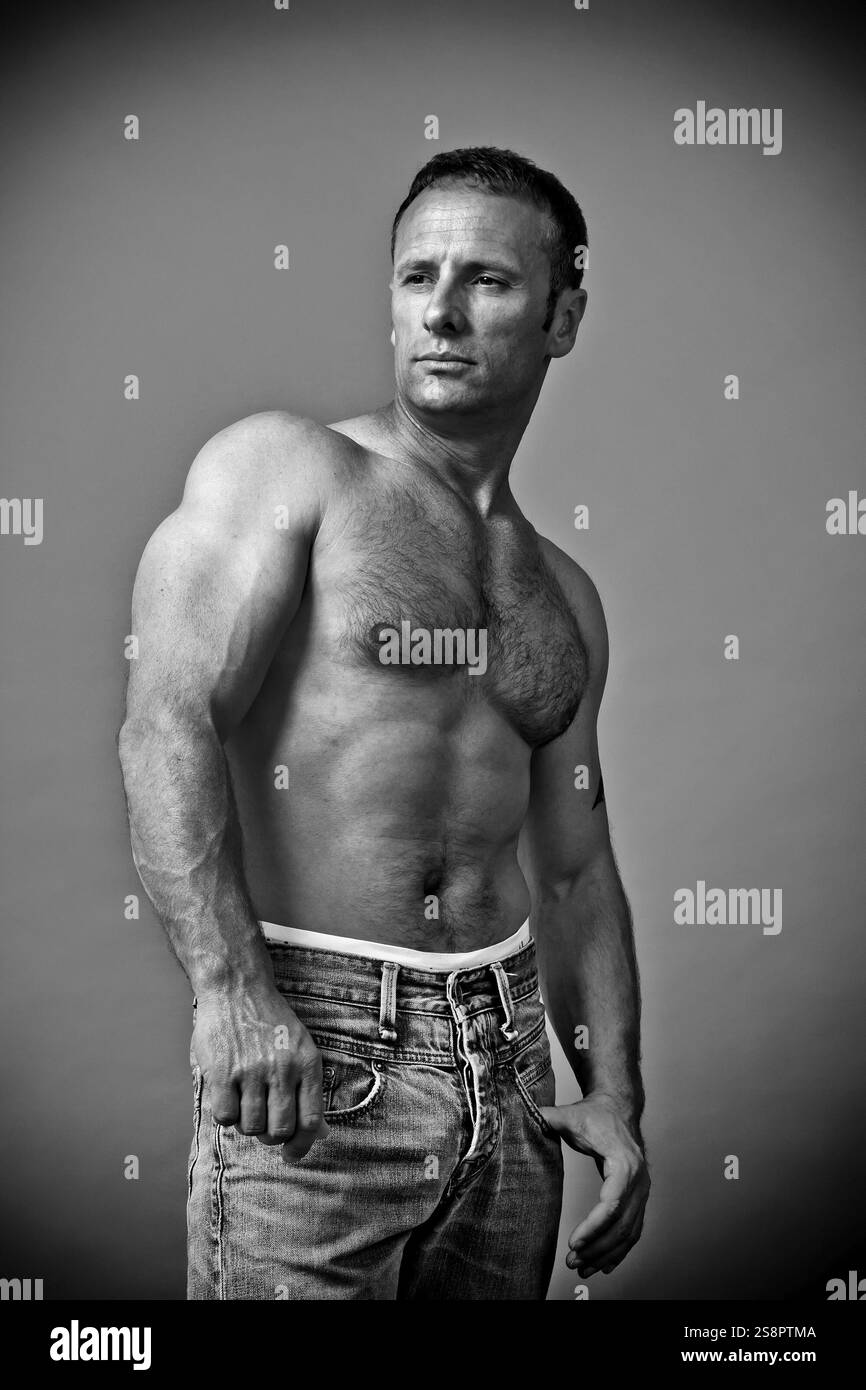 An image of a handsome muscle man black and white Stock Photo - Alamy