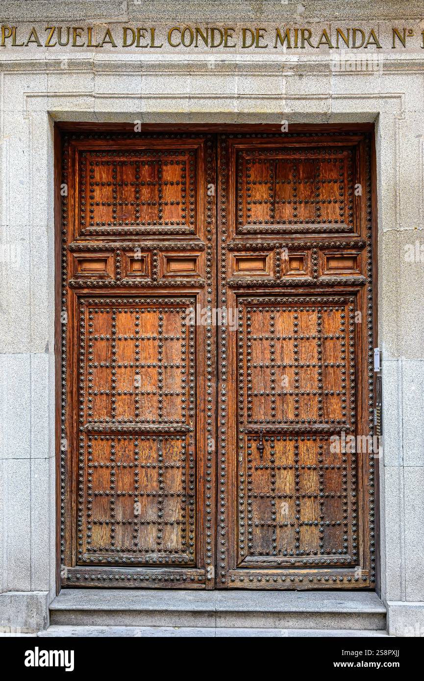 Ancient entrance door to building in the Plaza de Miranda, Madrid ...
