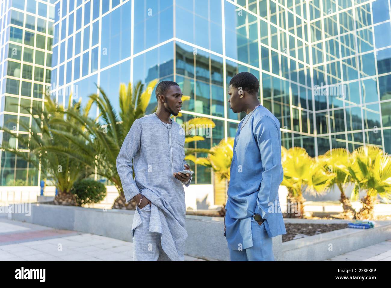 Two senegalese businessmen wearing traditional dashiki attire are ...