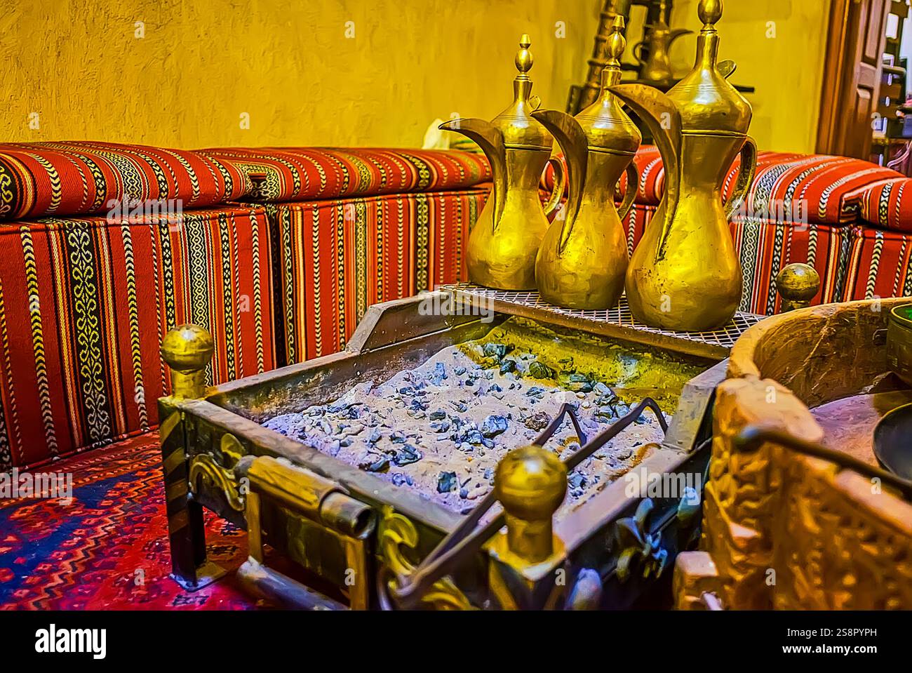 The vintage charcoal stove with old dallah coffee pots for Arabic ...