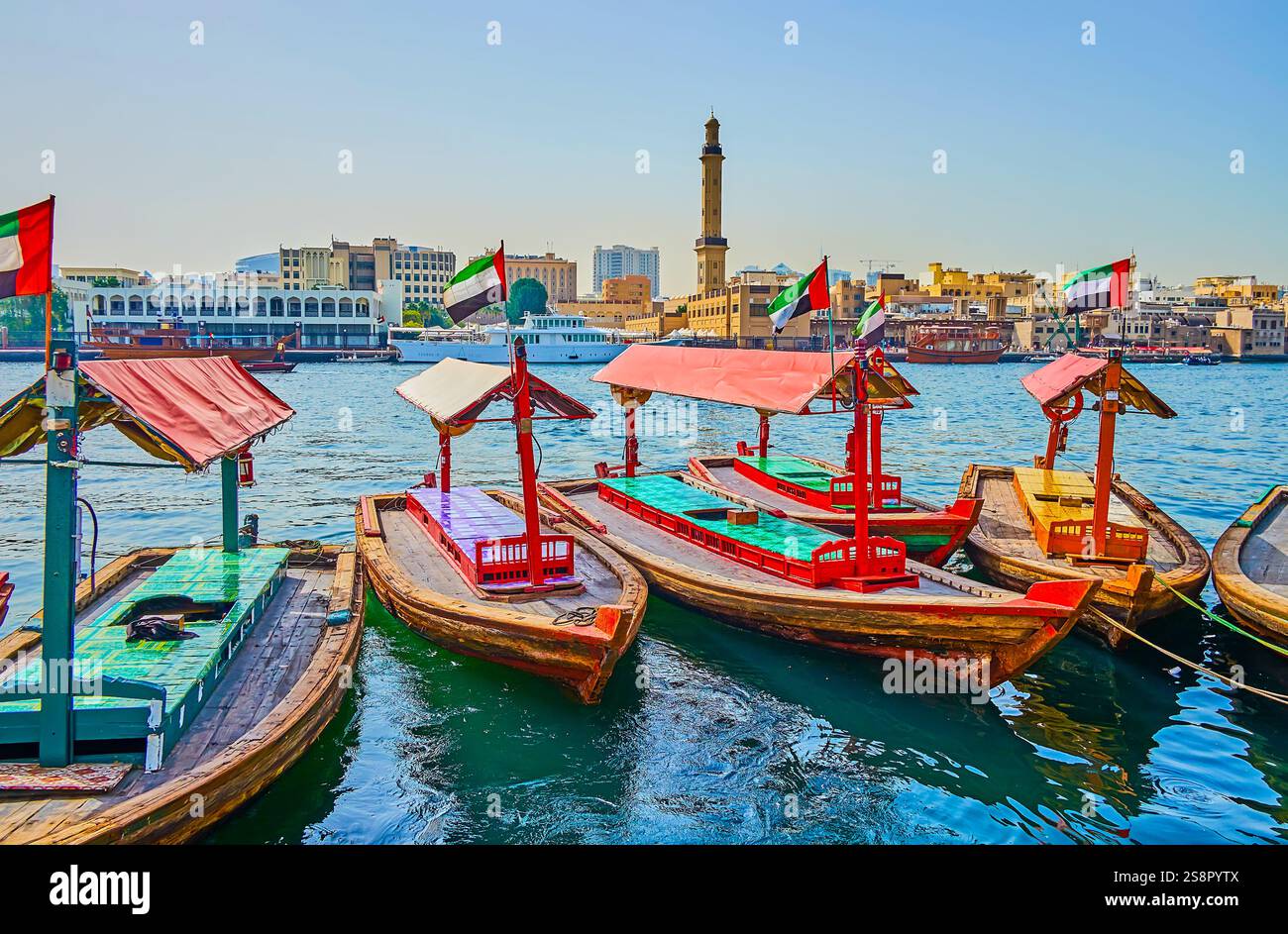 The abra boats are traditional passenger transport, floating across ...