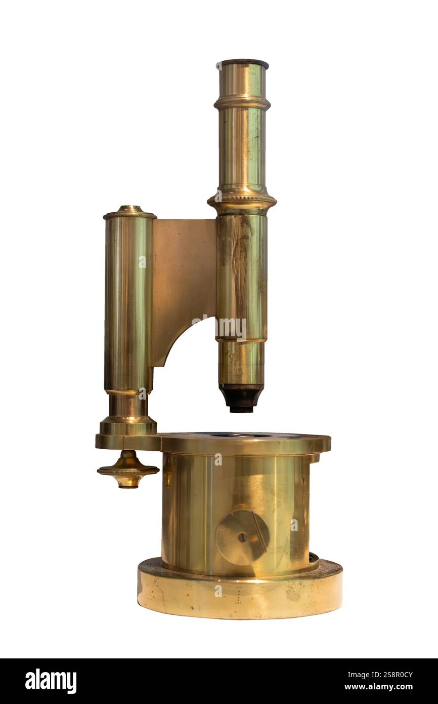 Antique brass microscope with intricate details isolated on white ...