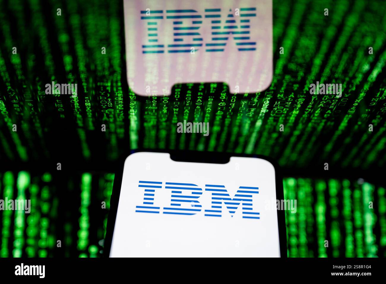 In this photo illustration, the IBM logo seen displayed on a smartphone ...
