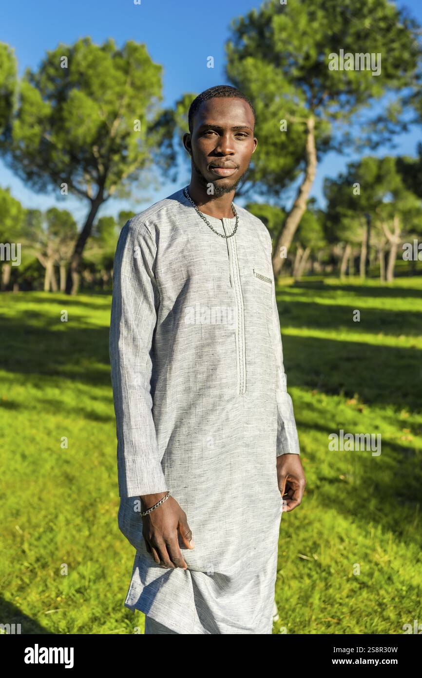 Portrait of a senegalese man wearing a dashiki in a park, representing ...
