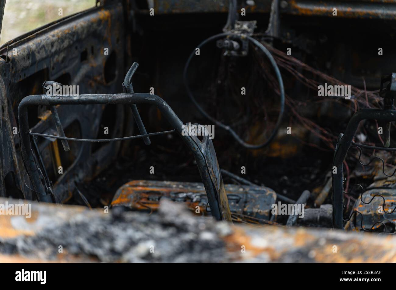 Burnt-out interior of a passenger car. The car is completely destroyed ...