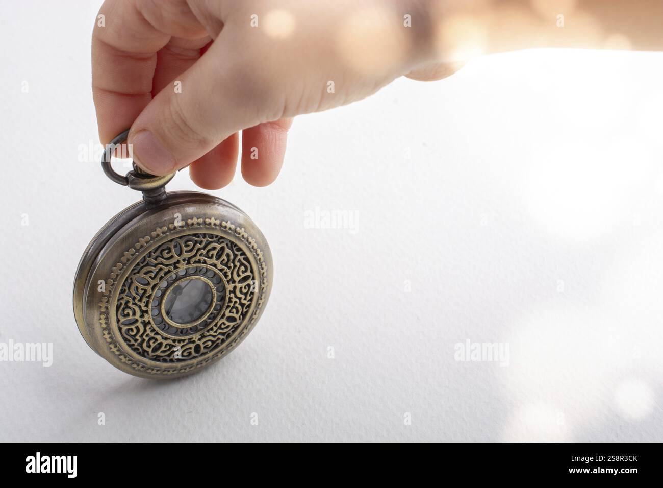 Retro style pocket watch in the hand Stock Photo - Alamy