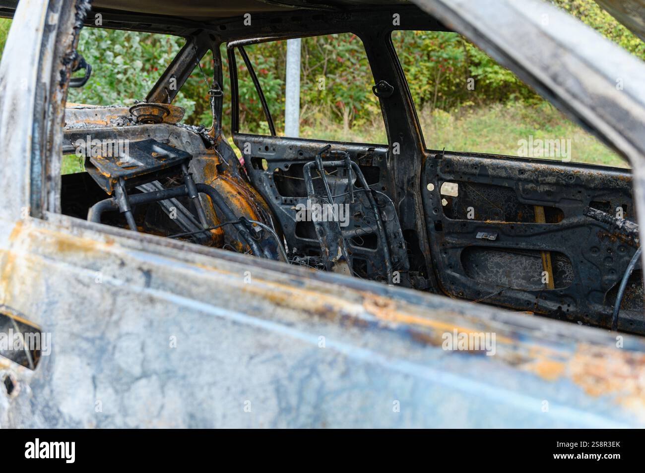 Burnt-out interior of a passenger car. The car is completely destroyed ...