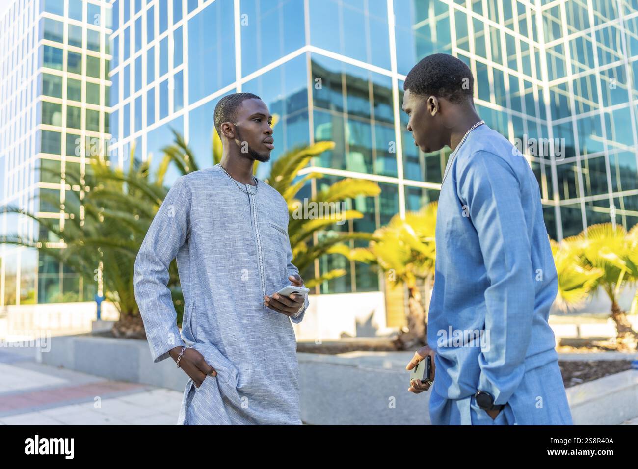 Two senegalese businessmen wearing traditional dashiki attire are ...
