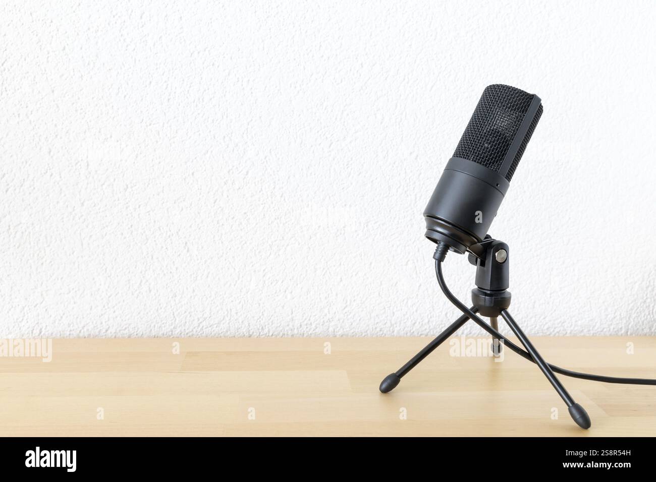 An image of a typical microphone on white background Stock Photo - Alamy