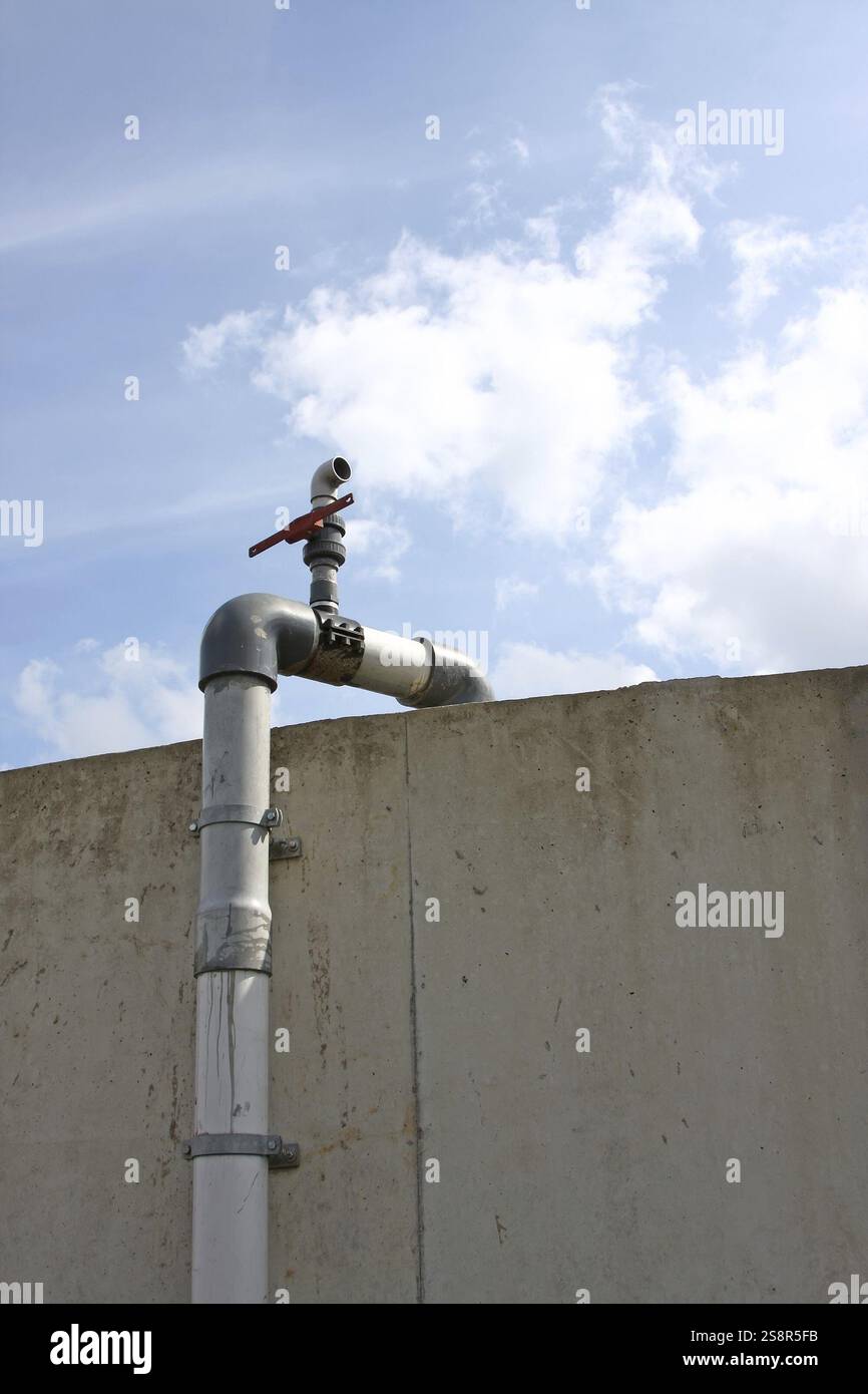 An image of a silo pipe blue sky background Stock Photo - Alamy
