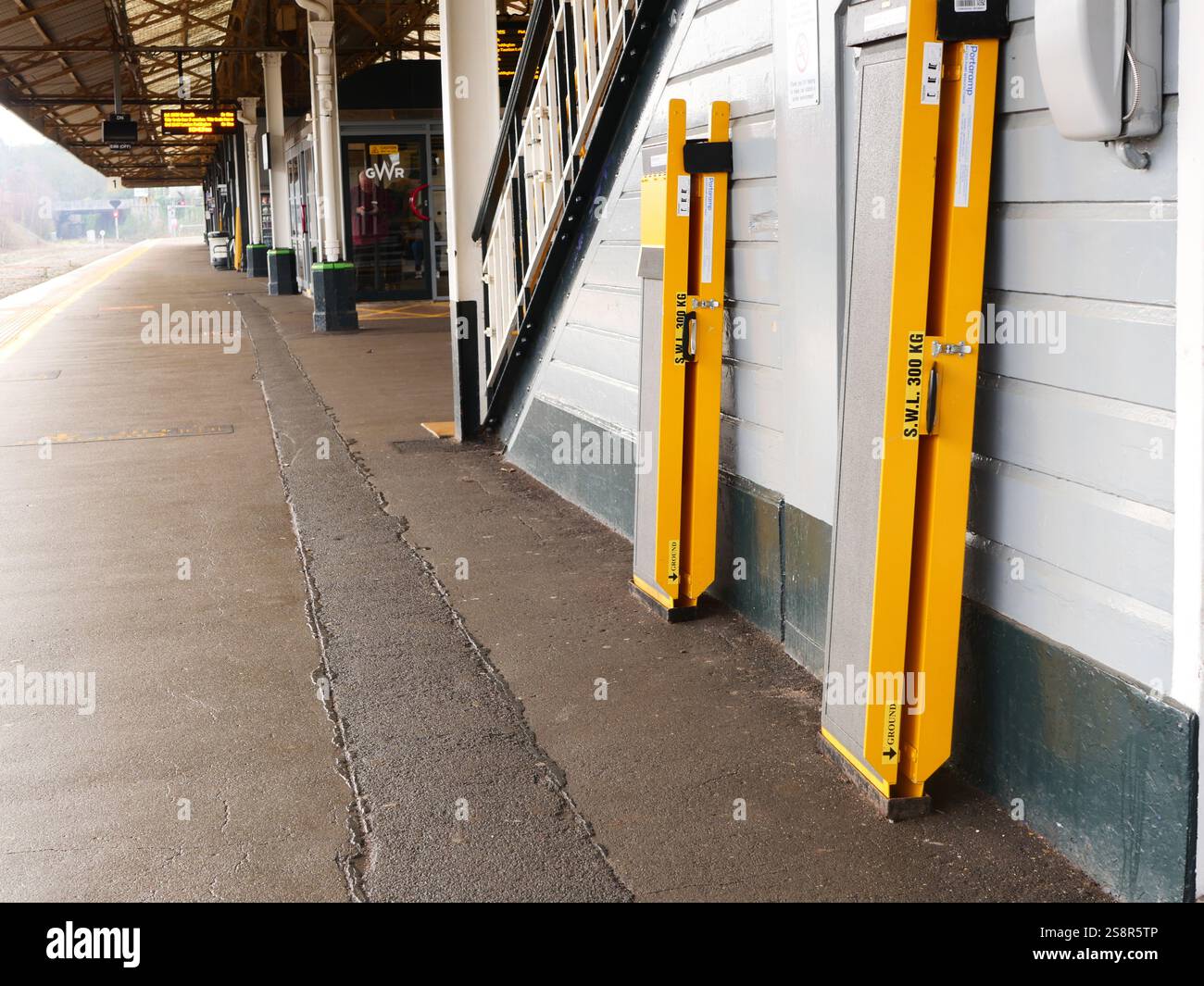Disability access ramps on railway station platform ready for rail ...