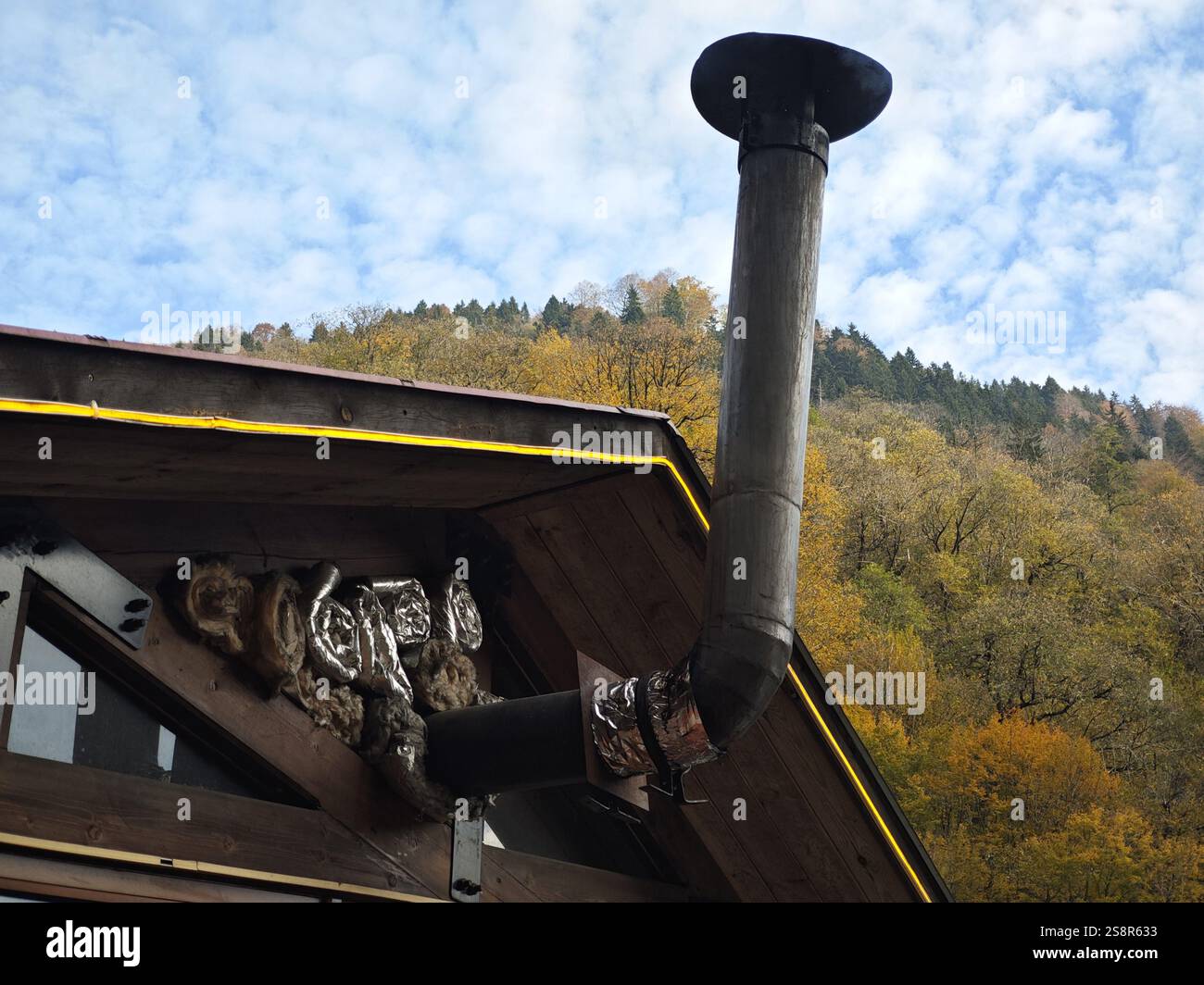 A smoke chimney to vent smoke and gases from a fireplace, stove, and ...