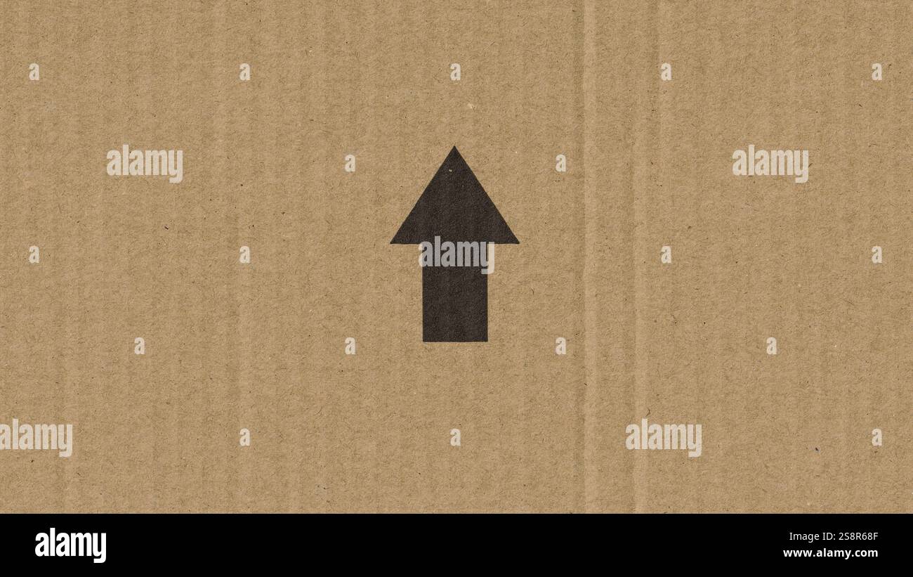 An image of a black arrow on a cardboard box Stock Photo - Alamy
