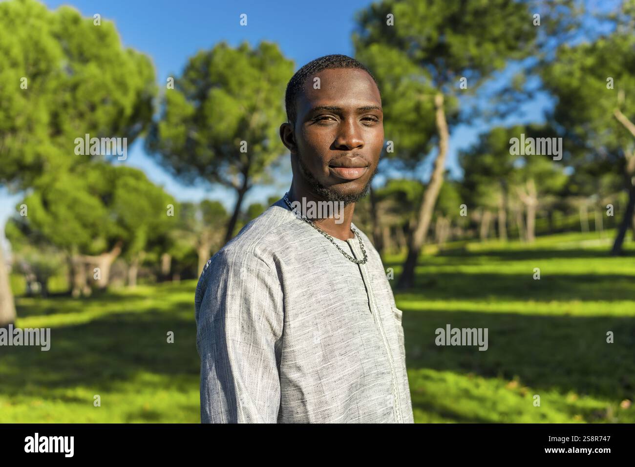 Portrait of a young african man from senegal wearing traditional ...