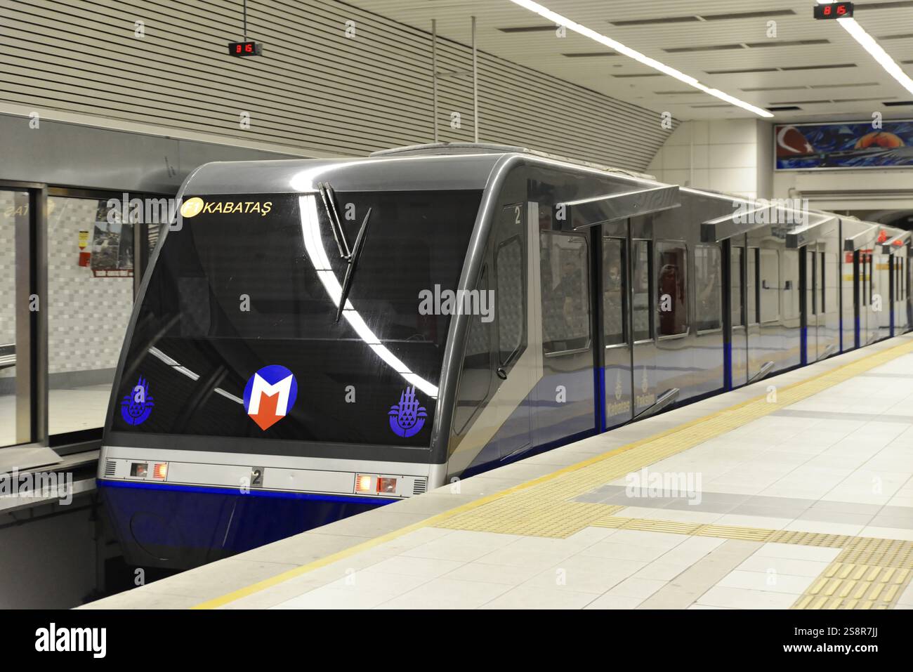 Modern metro train arriving or departing at Kabatas station, Istanbul ...