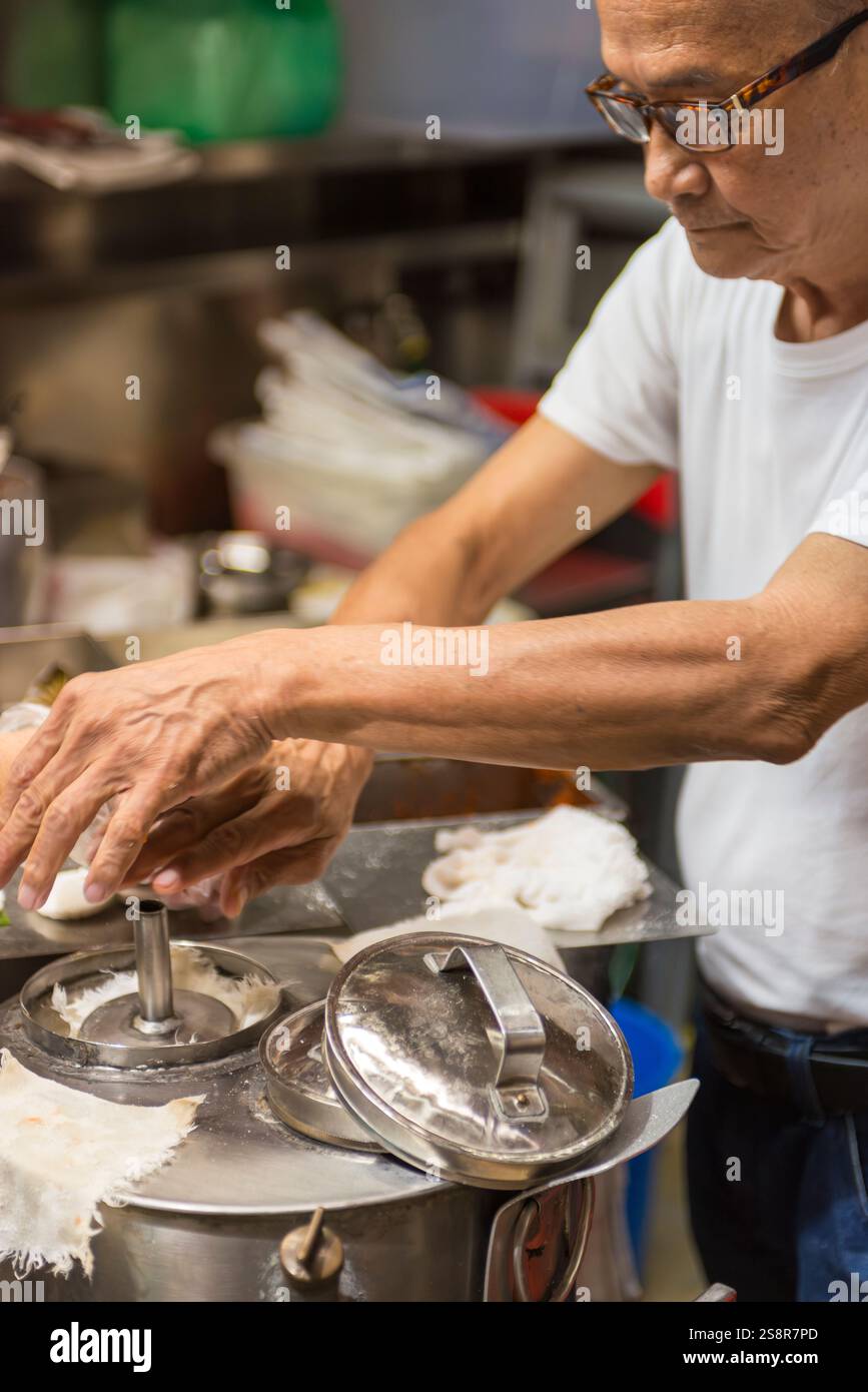 Putu Piring seller at Hawker stall in Singapore, Southeast Asia Stock ...
