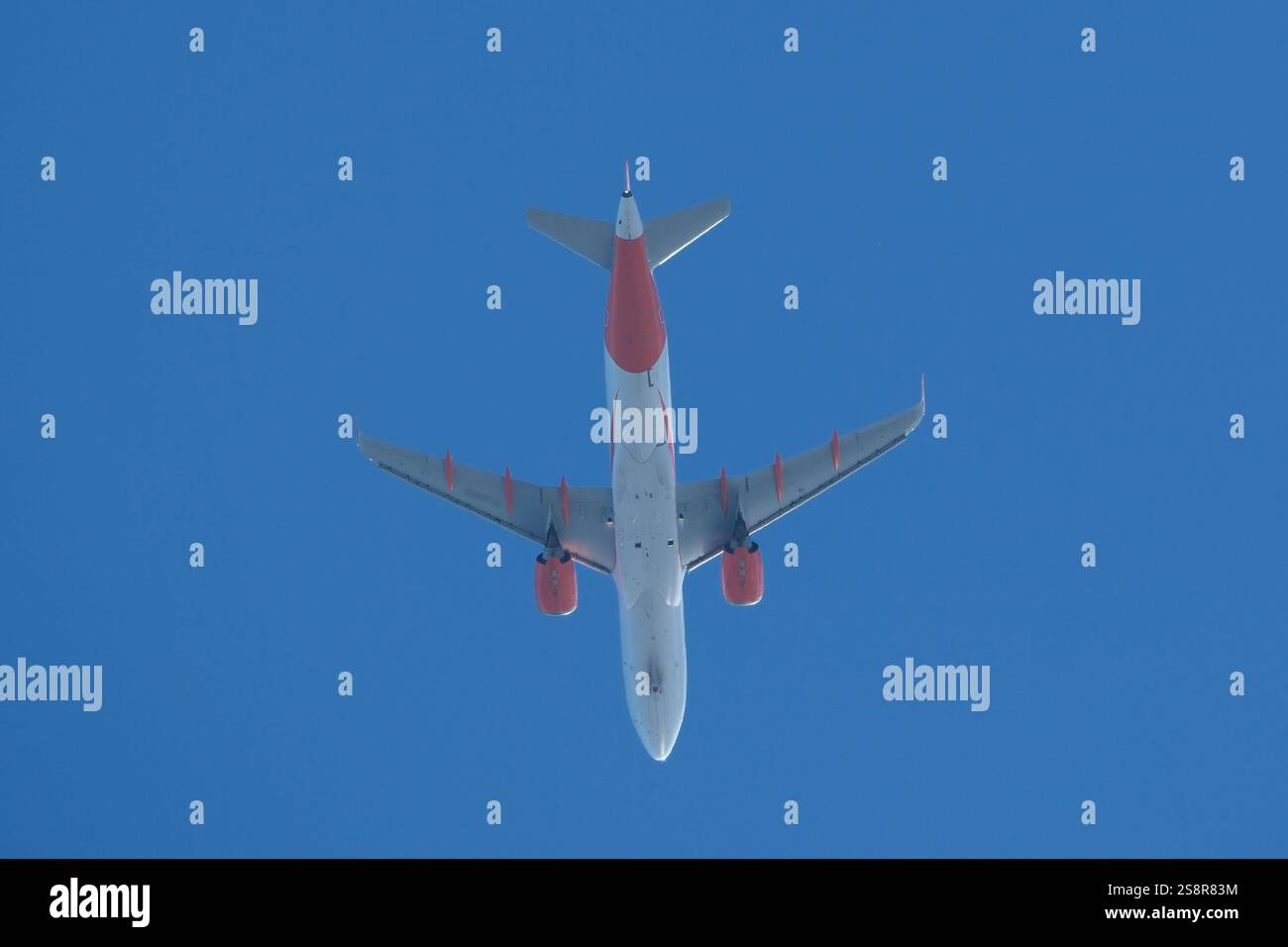 Jet airplane flying overhead in clear blue sky. Airplane in the blue ...