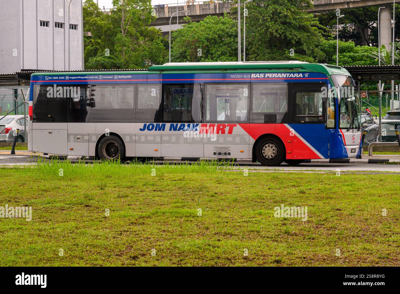 A stationary MRT feeder bus at Kuchai MRT station, Kuala Lumpur ...