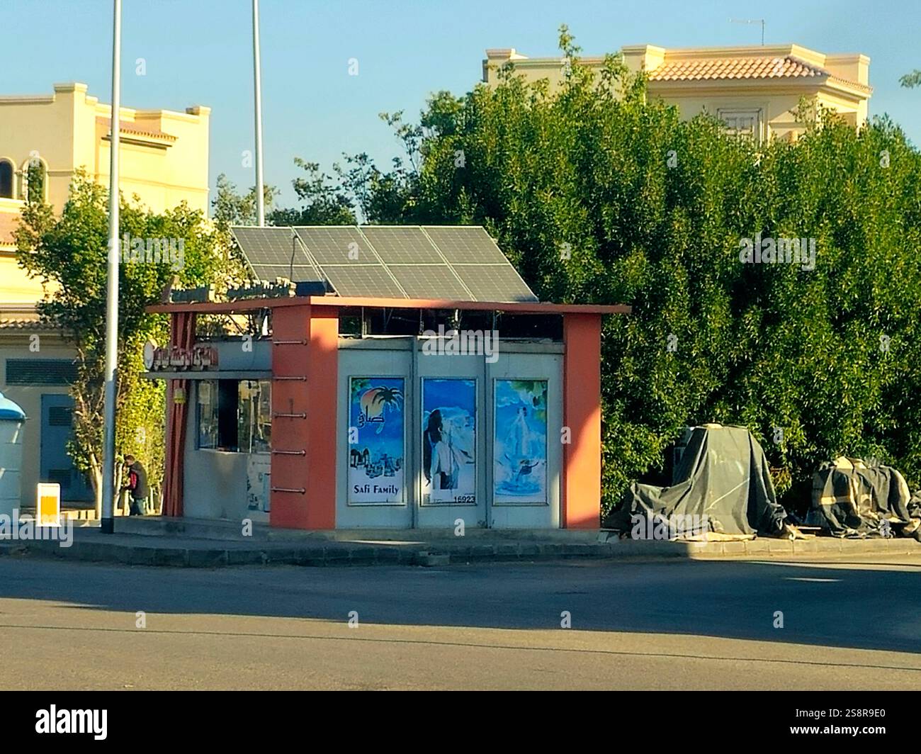 Cairo, Egypt, December 19 2024: a mini mart convenience store with Solar cells and panels in ...