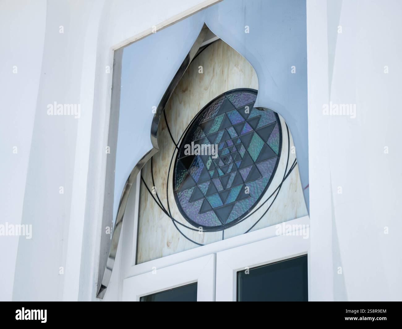 White windows in church with stained glass with various patterns ...