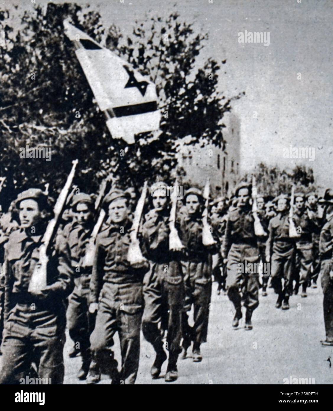 A march past by the new Israeli army during the War of Independence ...