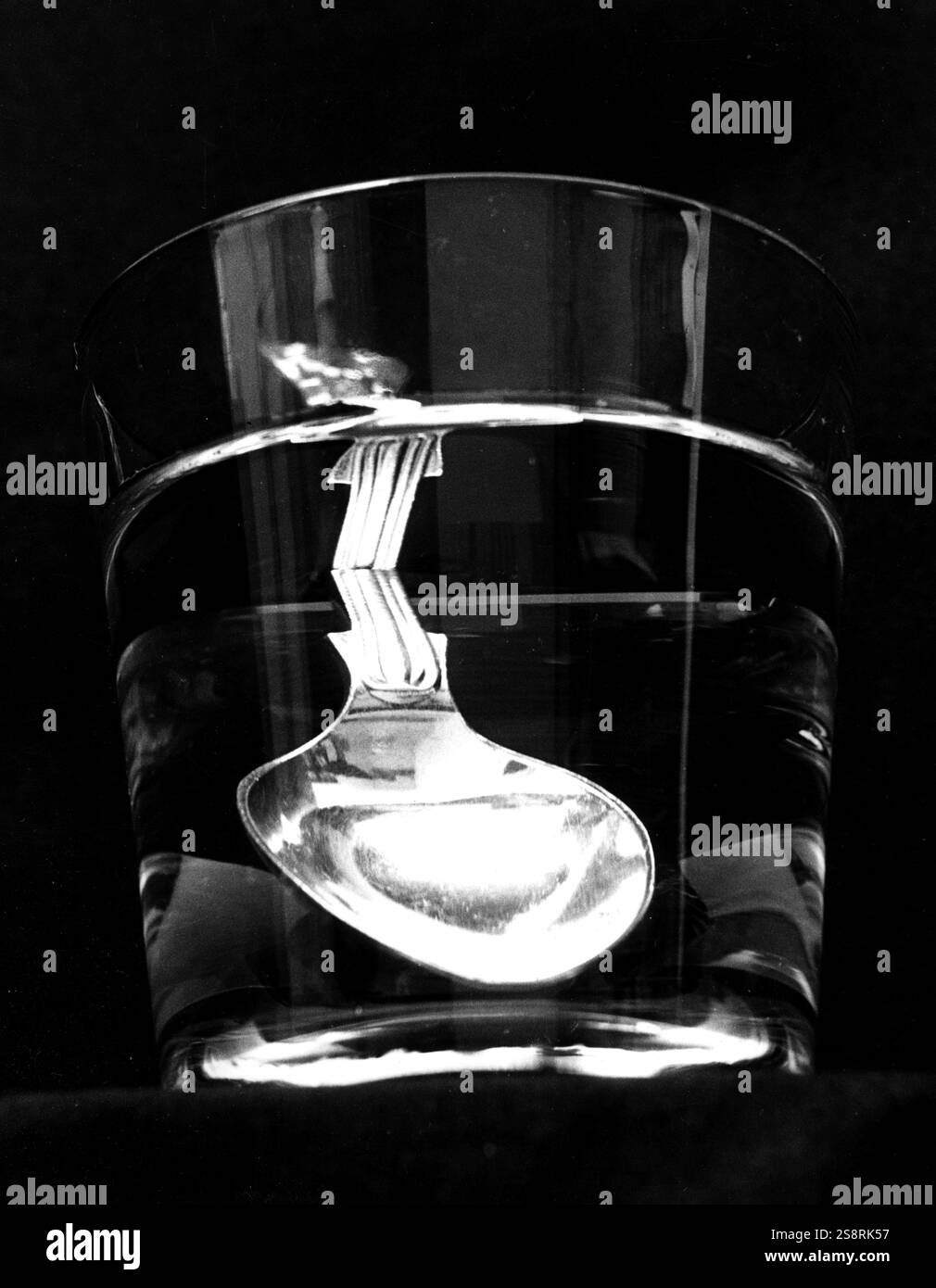 Photograph demonstrating total internal reflection: In a tumbler of ...